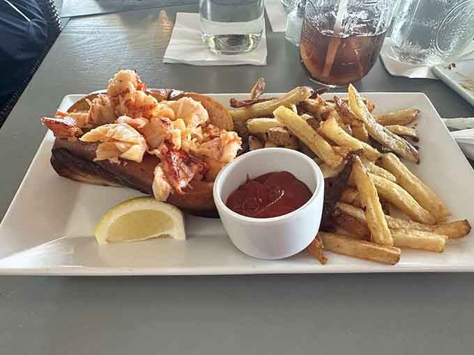 Golden lobster meat on a toasted bun with crispy fries &ndash; this is Connecticut's edible love letter.