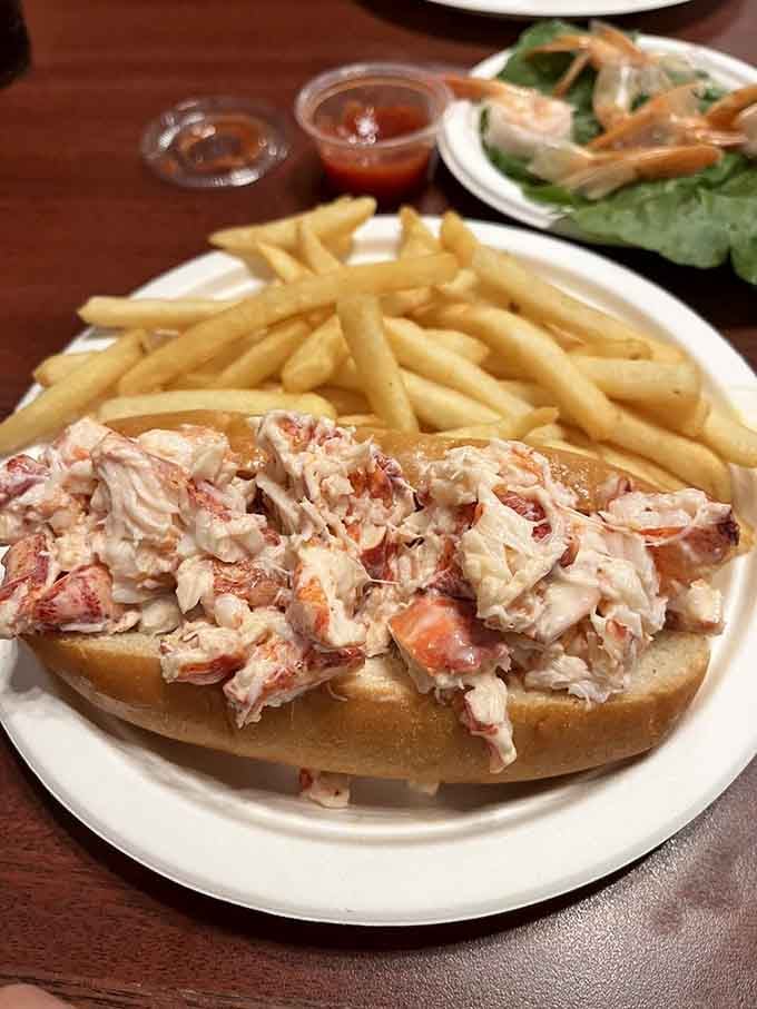 This isn't just a lobster roll; it's summer in New England captured between two pieces of perfectly toasted bread.