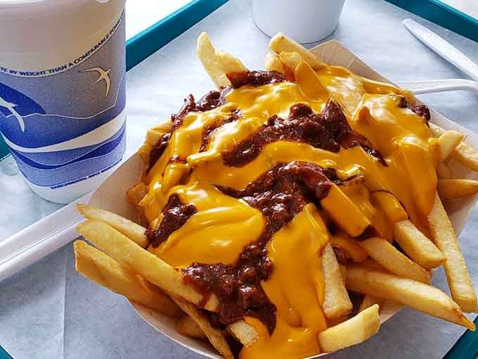Chili cheese fries that look like they could solve all of life's problems, one golden bite at a time.