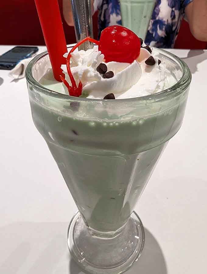 That mint green shake topped with whipped cream and a cherry is basically happiness in a glass.