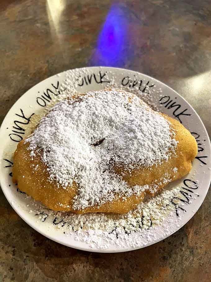 This powdered sugar-dusted scone isn't just baked &ndash; it's engineered for maximum happiness, a golden cloud of morning bliss.