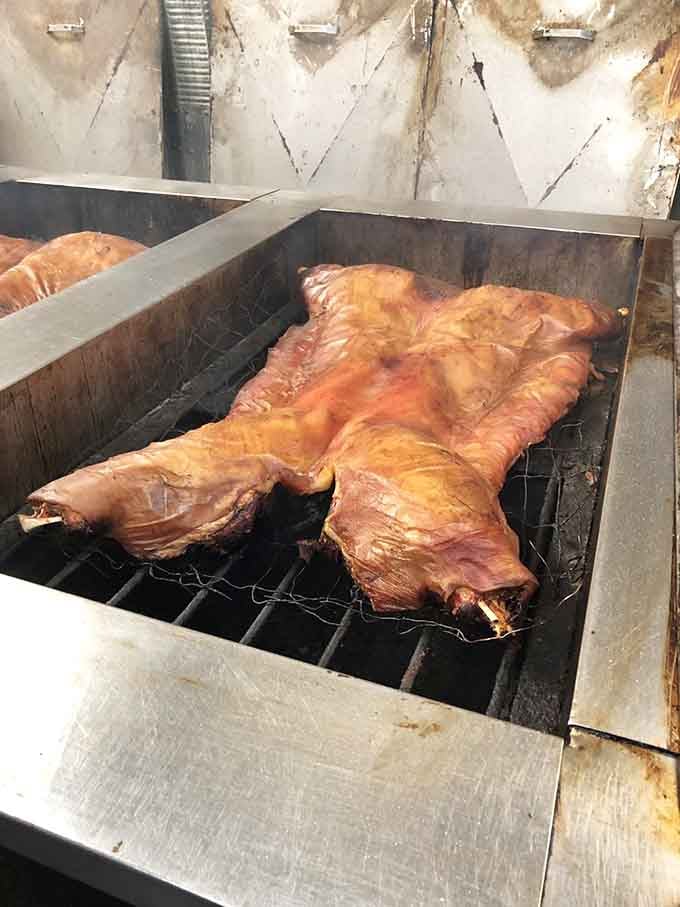 Behold the whole hog in its natural habitat, slowly transforming into something that'll haunt your dreams in the best way.