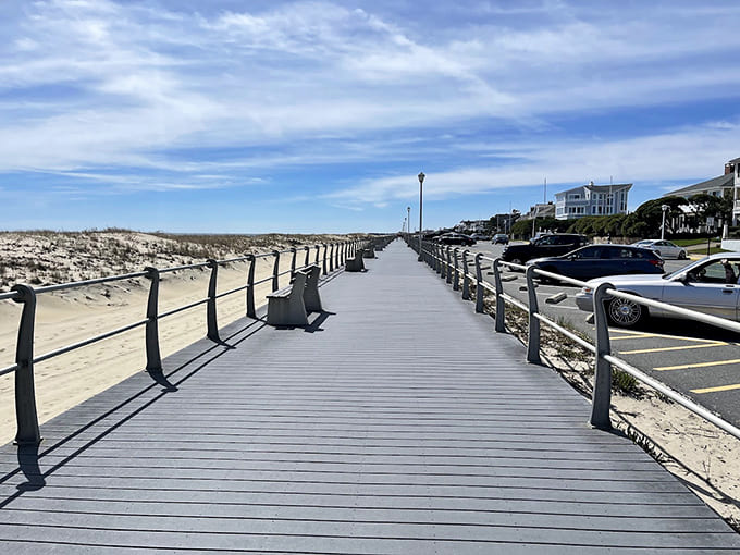 The boardwalk stretches toward the horizon, where lighthouse keepers once scanned for ships in distress.