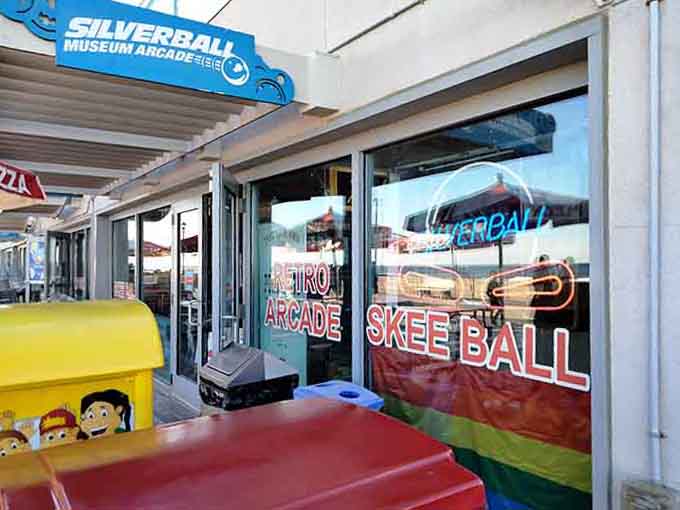 The entrance to the arcade invites you with neon signs and endless possibilities for retro gaming adventures.