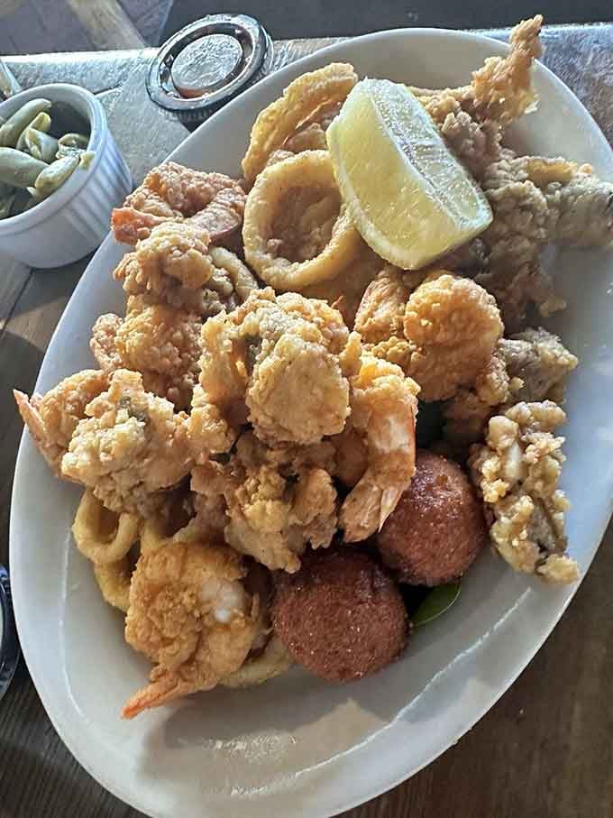 This seafood platter looks like the ocean decided to throw a party on your plate, complete with hushpuppies.
