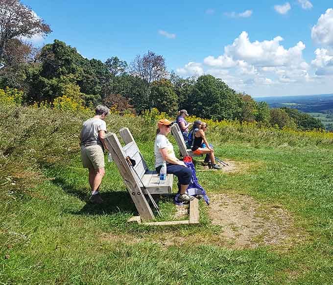 Nothing says "we found the good spot" quite like folks claiming benches with million-dollar views for free.
