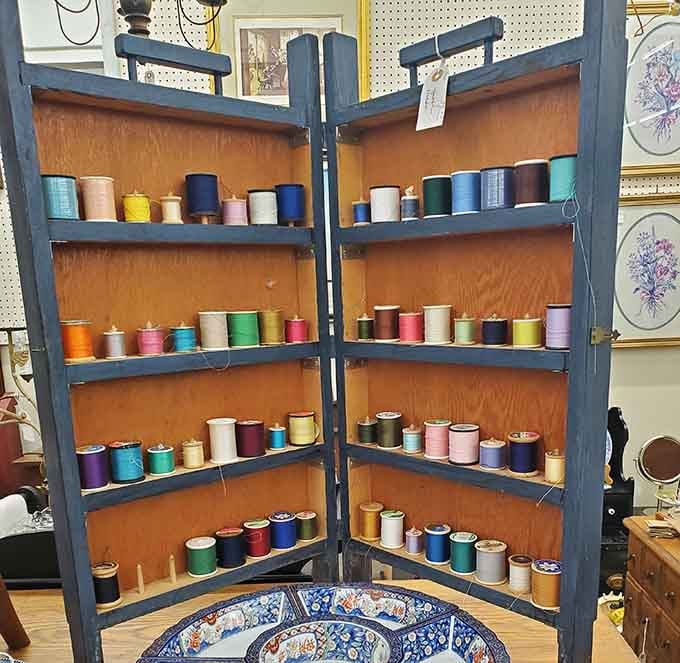 Every shade of thread imaginable sits ready for quilters and seamstresses who appreciate vintage craftsmanship.