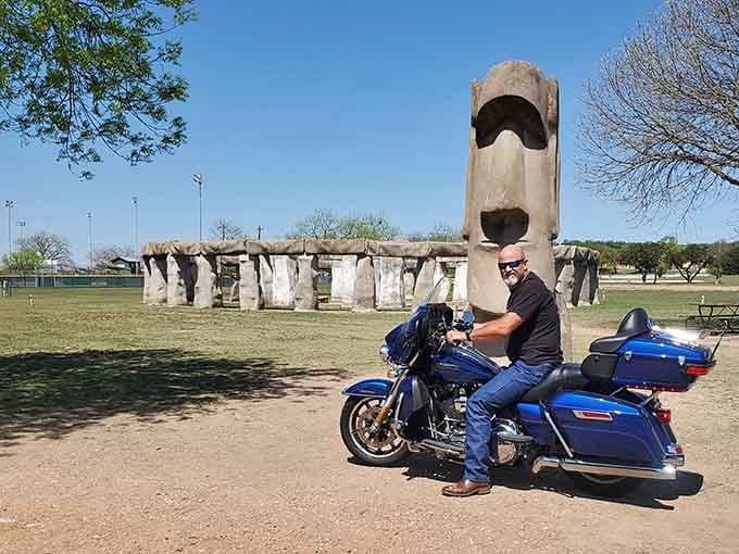 Even the parking lot moai welcomes visitors, standing guard between modern vehicles and ancient architectural inspiration.