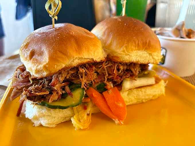 Two golden buns cradling a mountain of tender pulled pork, this is sandwich architecture at its finest.
