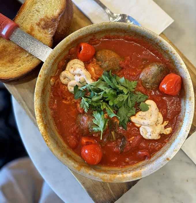 Poached eggs swimming in spiced tomato sauce with crusty bread for dunking is how mornings should always start.