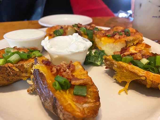 Potato skins loaded with bacon, cheese, and sour cream deliver comfort food that needs no flight plan, just forks.