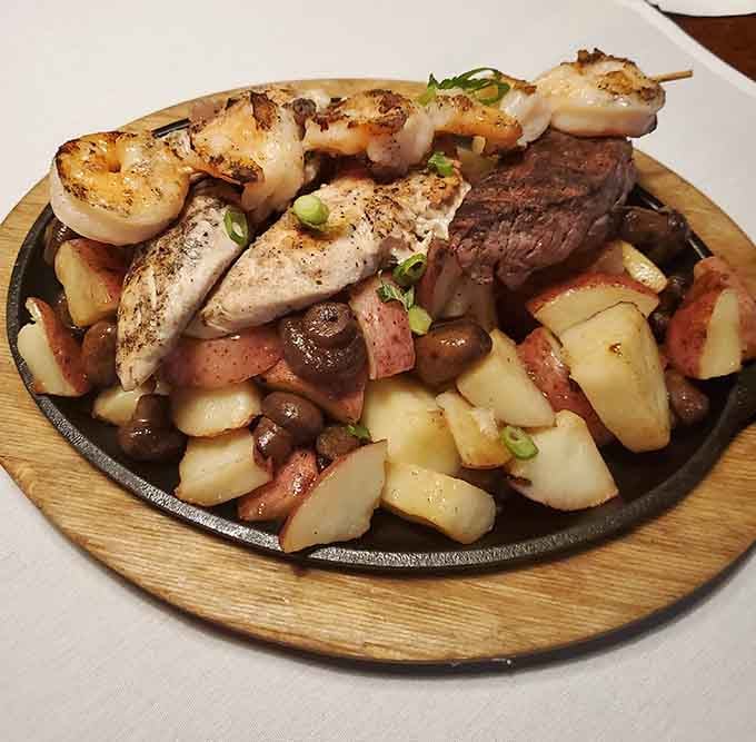 Surf meets turf on a sizzling platter that makes choosing between land and sea completely unnecessary and wonderfully indulgent.