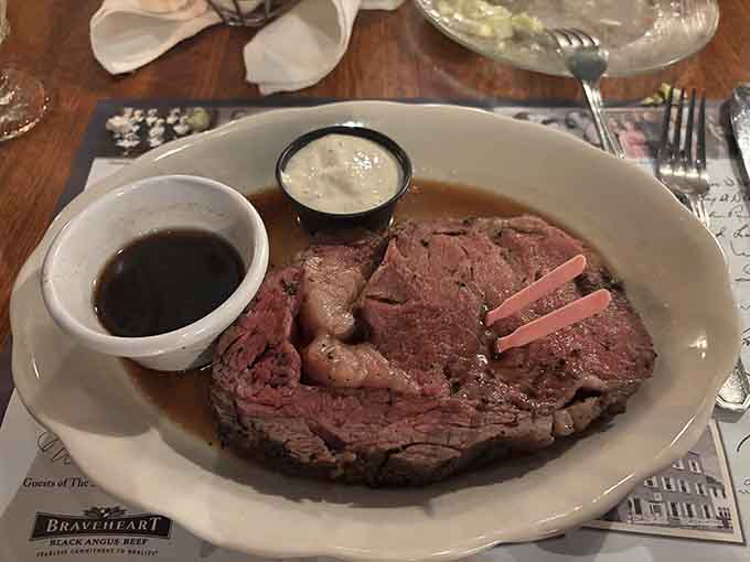 Prime rib sliced thick enough to make you reconsider your life choices, served with au jus and horseradish dignity.