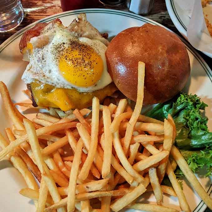 That burger topped with a fried egg isn't playing around, it's here to make your taste buds very happy.