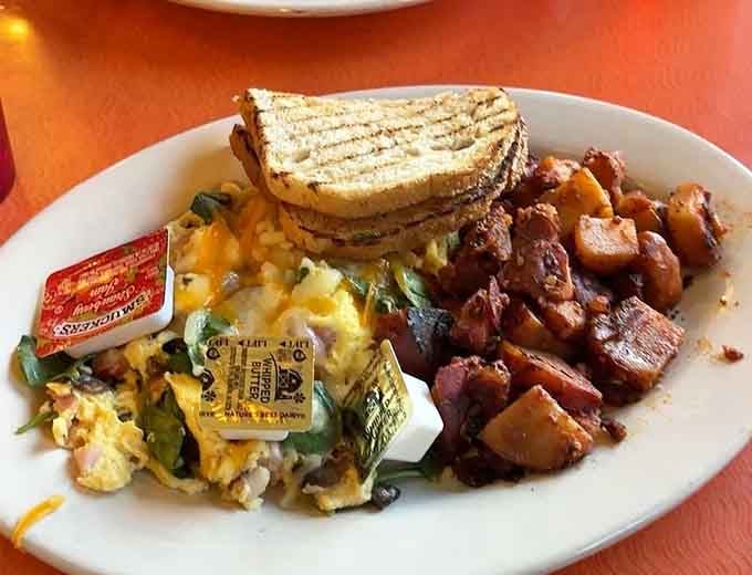 Scrambled eggs, toast, and perfectly crispy home fries prove sometimes classics need no improvement whatsoever.