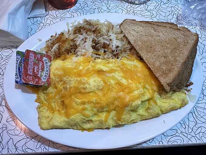 That omelet is fluffier than a cloud and twice as satisfying, with hash browns for good measure.
