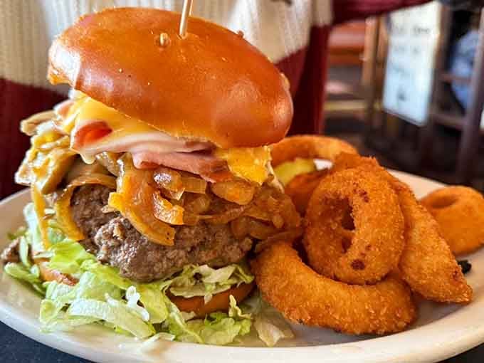 Behold the engineering marvel that is this burger, complete with a structural support toothpick for stability.
