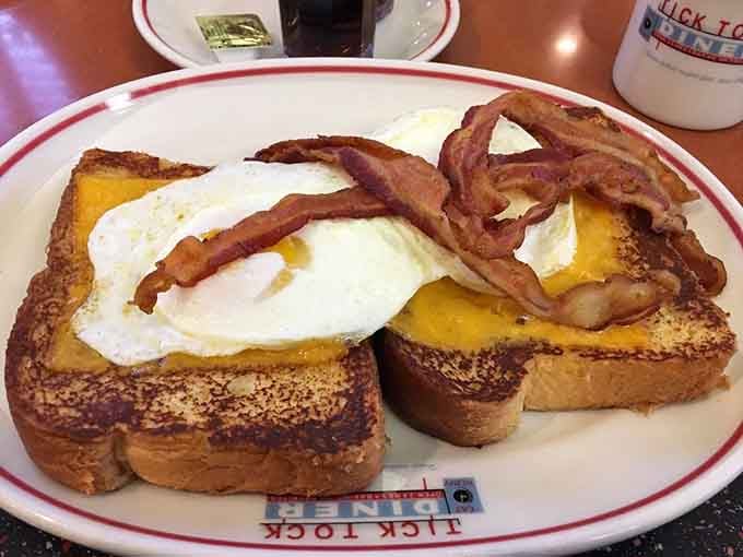 The Big Frenchie: thick toast, eggs, bacon, and enough cheese to make your cardiologist schedule an intervention.