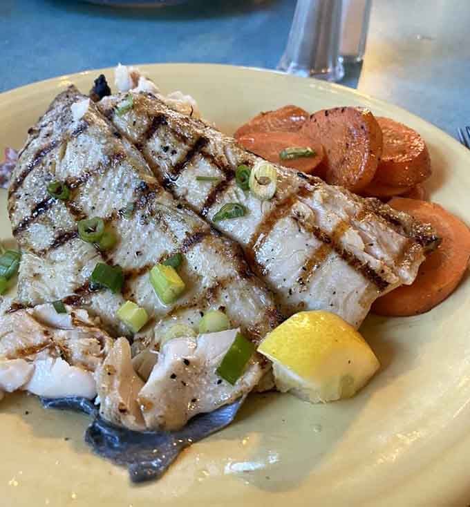 Perfectly grilled trout with those gorgeous char marks that make your mouth water just looking at it.