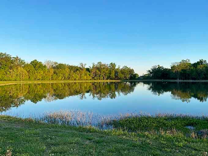 Tolen Creek's mirror-like surface reflects both clouds and retirement dreams, offering peaceful moments without premium waterfront pricing.