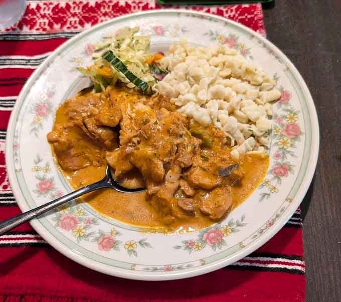Chicken paprikash with homemade spaetzle proves that comfort food transcends borders and speaks a universal language of deliciousness.