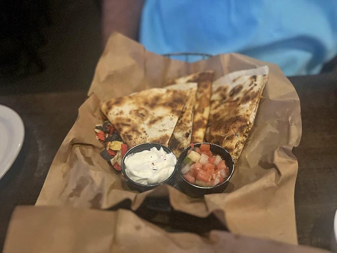 Golden, grilled quesadilla perfection that proves trolls understand the universal language of melted cheese and satisfaction.