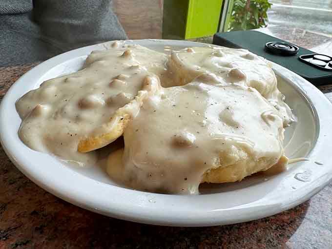 Biscuits drowning in gravy, because sometimes you need comfort food that doesn't apologize for anything.