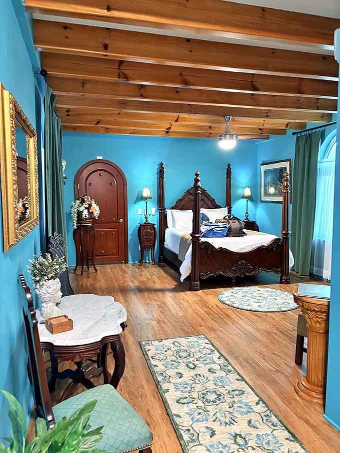 Turquoise bedroom with four-poster bed proves sleeping like royalty doesn't require an actual kingdom or passport.