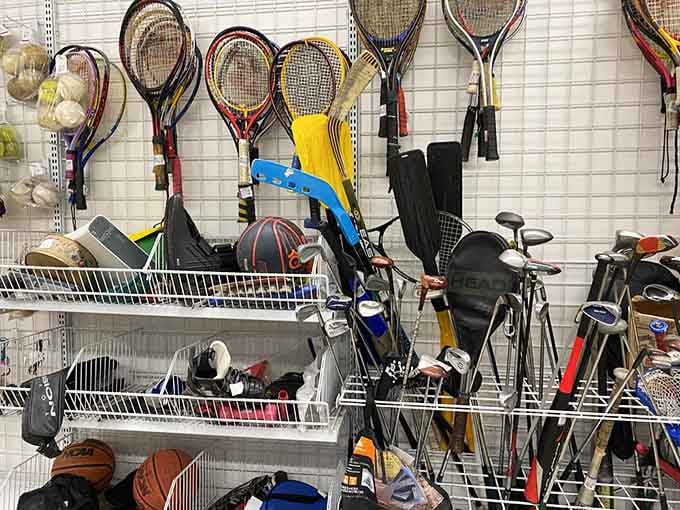 Tennis rackets and golf clubs waiting patiently for someone to give them another chance at glory on the courts and greens.