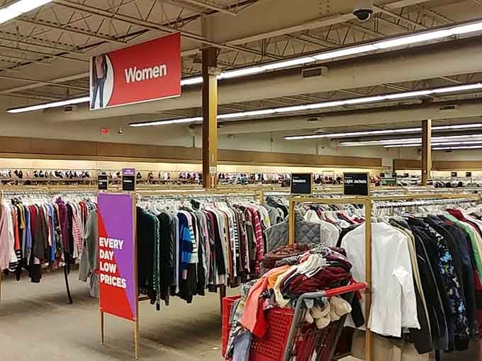 The women's section stretches into the distance like a fabric rainbow, organized better than most department stores.