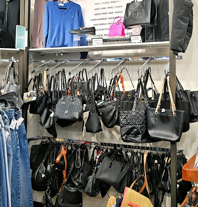 Handbags hanging like fashion fruit ripe for picking, each one waiting to complete an outfit you haven't planned yet.