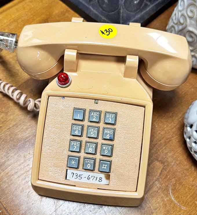 Remember when phones couldn't fit in your pocket? This beige beauty from yesteryear would make any Gen-Z visitor ask, "What's that contraption?"