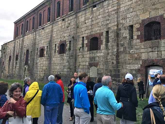 Tour groups gather along the massive stone walls, where guides bring history to life. These aren't just rocks&mdash;they're chapters in America's coastal defense story.