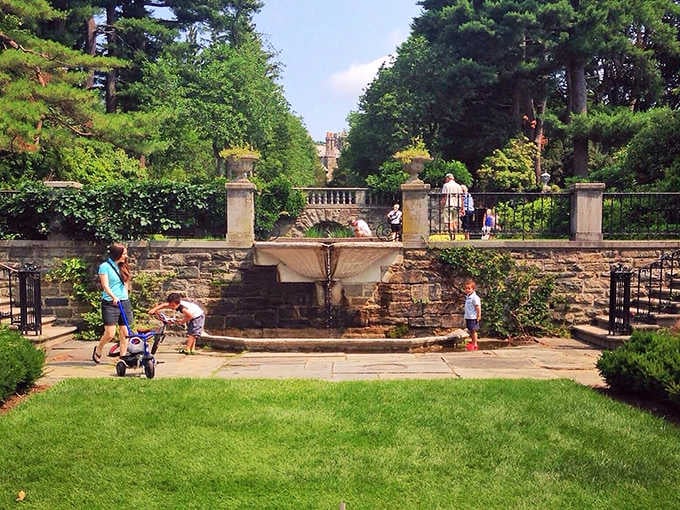 Family fountain fun on a summer day. Nothing says "childhood memory in the making" quite like the irresistible combination of water, sunshine, and inevitable ice cream negotiations.