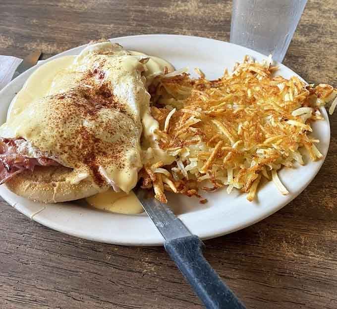 Eggs Benedict with hash browns so golden and crispy, they could make a morning person out of anyone.