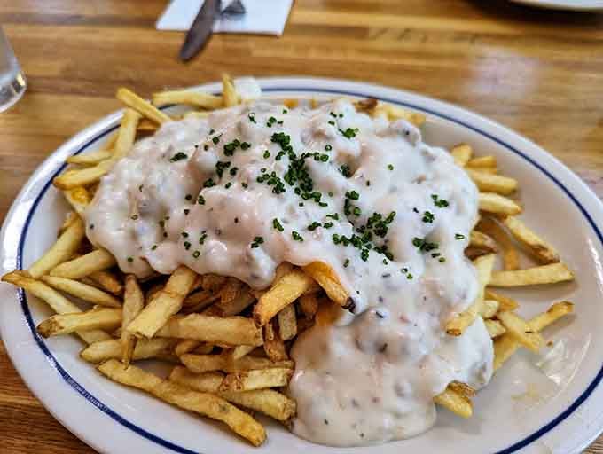 Poutine smothered in gravy proves that comfort food knows no borders, only hungry people with good taste.