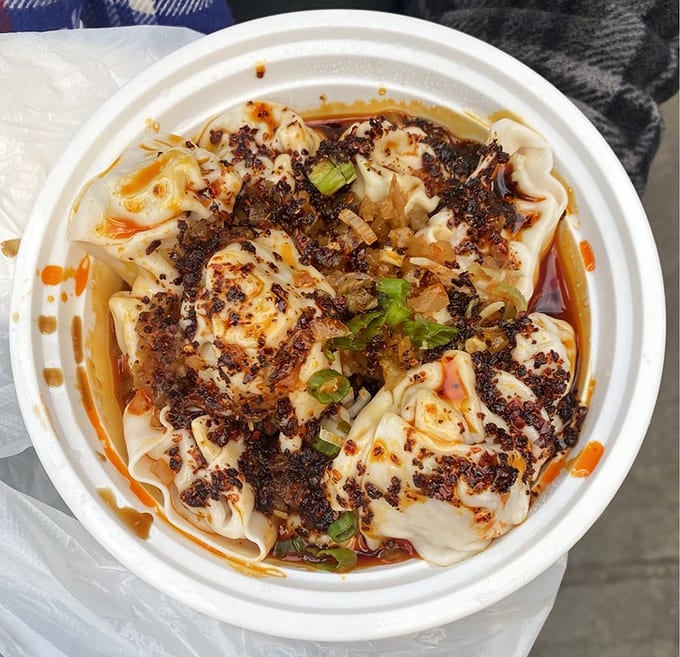 Those glistening pools of chili oil aren't just for show, they're your ticket to flavor paradise.