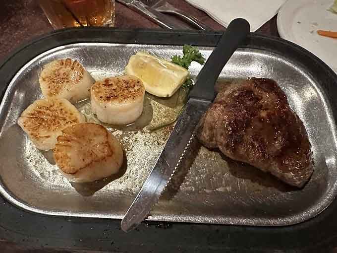 Perfectly seared scallops meet a beautifully cooked steak on one glorious platter, because why choose just one protein?