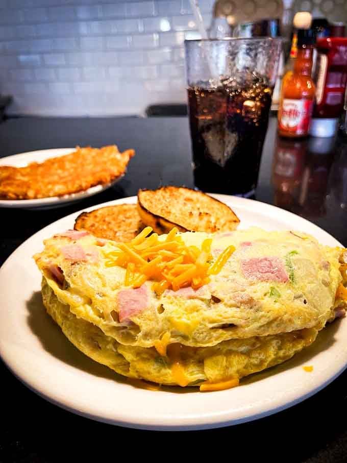 That Western omelette looks like it could feed a small village or one very grateful breakfast enthusiast.