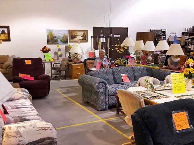 Furniture finds await the patient shopper. That blue floral couch might have stories to tell from another era entirely.