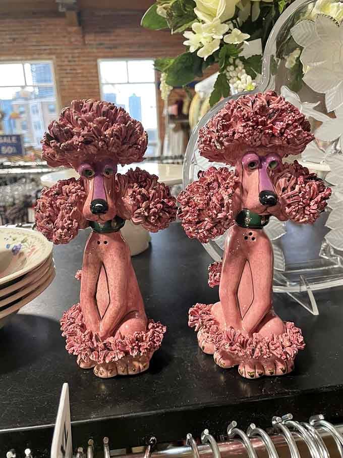 Pink poodle figurines proving that someone's questionable taste is your quirky home decor goldmine waiting to happen.