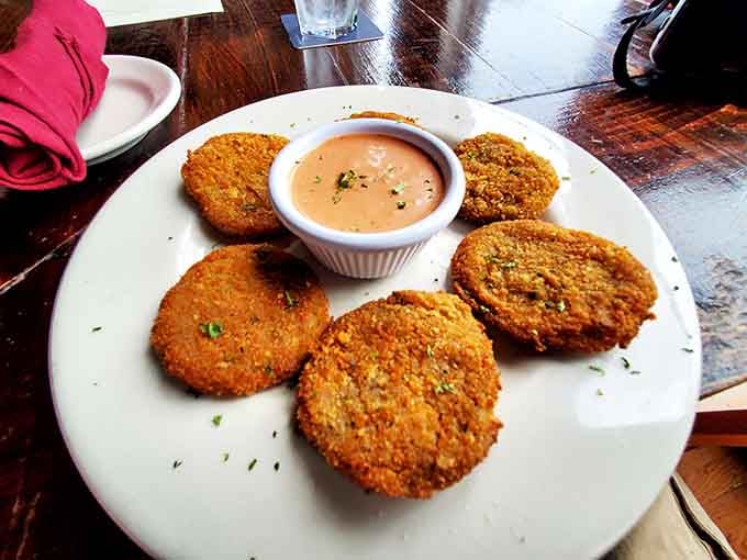 The star of the show: golden-brown fried green tomatoes with a cornmeal crust so perfect it should have its own fan club and remoulade sauce worth bottling.