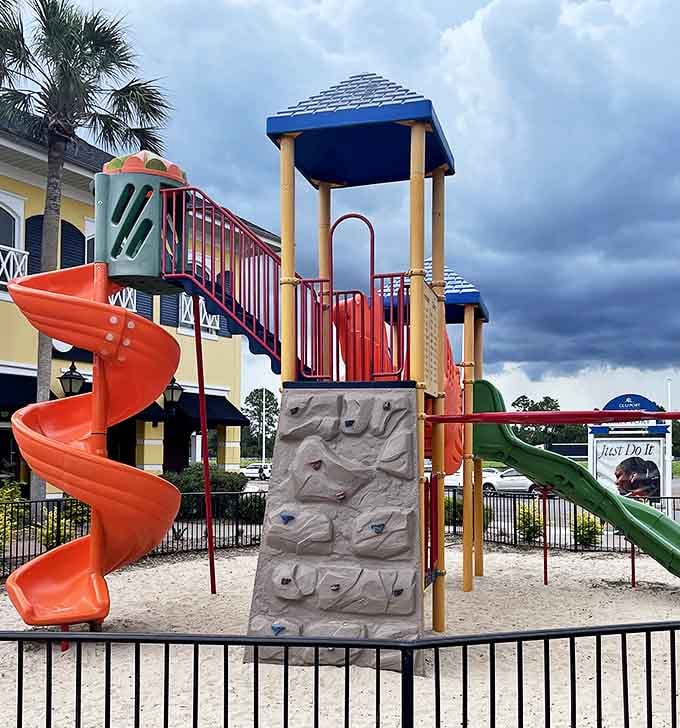 This colorful playground offers the only place where kids might have more fun than parents finding 70% off designer labels. The climbing wall trains little ones for scaling clearance racks later in life.