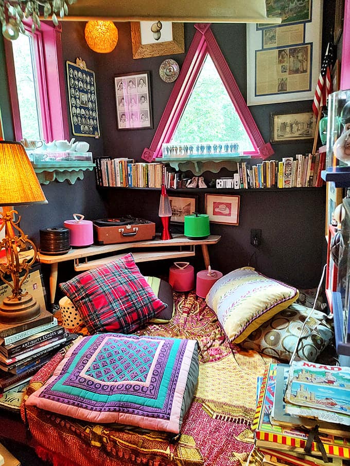 This cozy reading nook with its triangle window and vintage treasures is where Dr. Seuss might have written his next masterpiece.