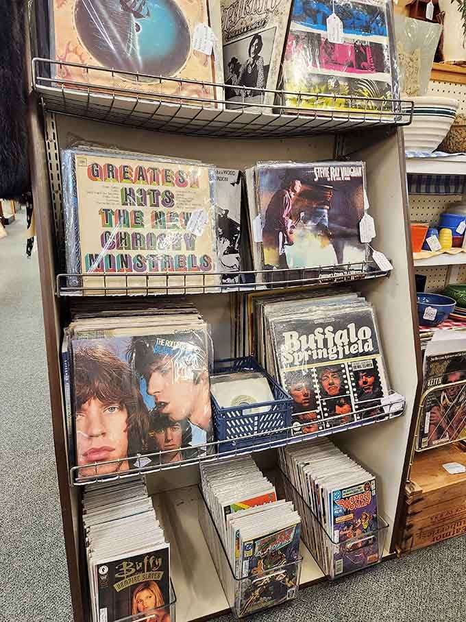 Rock history preserved in vinyl form—The Rolling Stones, Buffalo Springfield, and comic books below. The soundtrack to several generations' rebellious phases.
