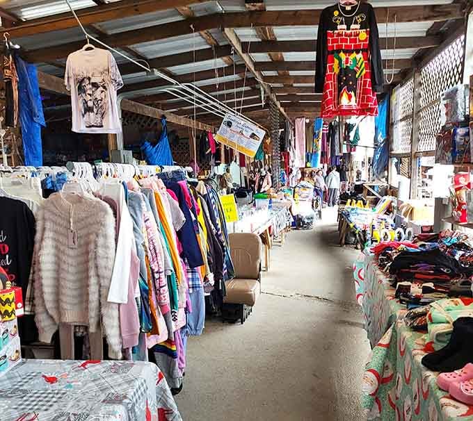 Clothing racks burst with color under metal roofing, creating a kaleidoscope that would make Joseph jealous.