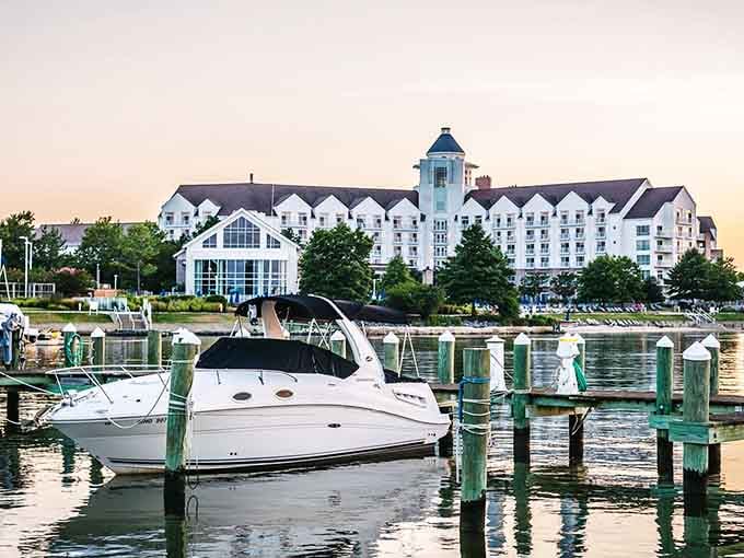 Waterfront living meets elegant architecture where boats bob gently beside buildings that could grace a New England calendar.