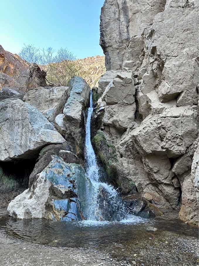 Finding a waterfall tucked in the desert feels like discovering an ice cream truck in the Sahara, wonderfully impossible.