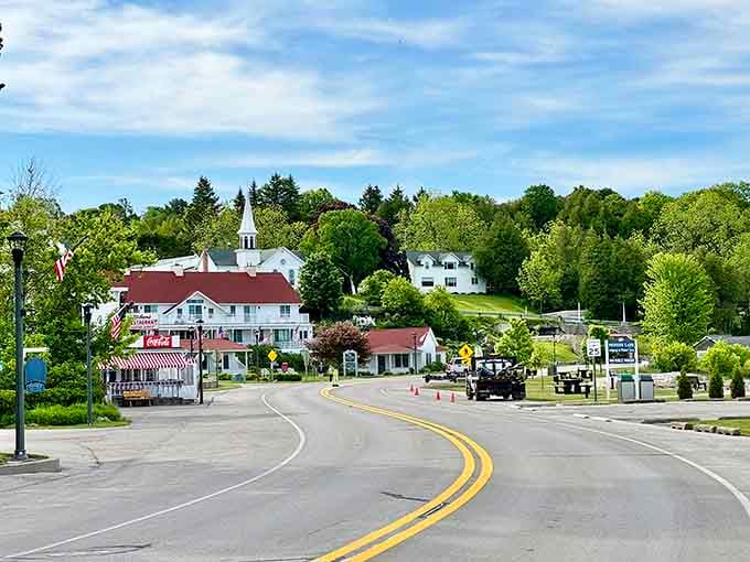 That curving road leads you into town like a welcoming handshake, promising good things around every bend.