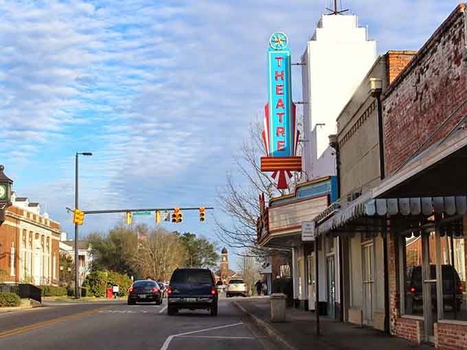 The vintage theater marquee glows like a beacon, promising entertainment just like the good old days.